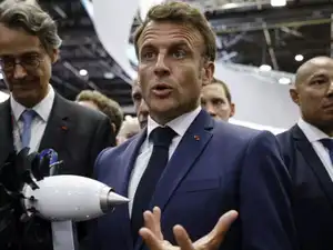 macron: Larger than life: Emmanuel Macron downs a beer to cheers, and ...
