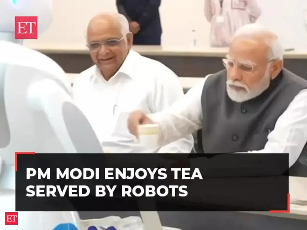 PM Modi enjoys tea served by robots