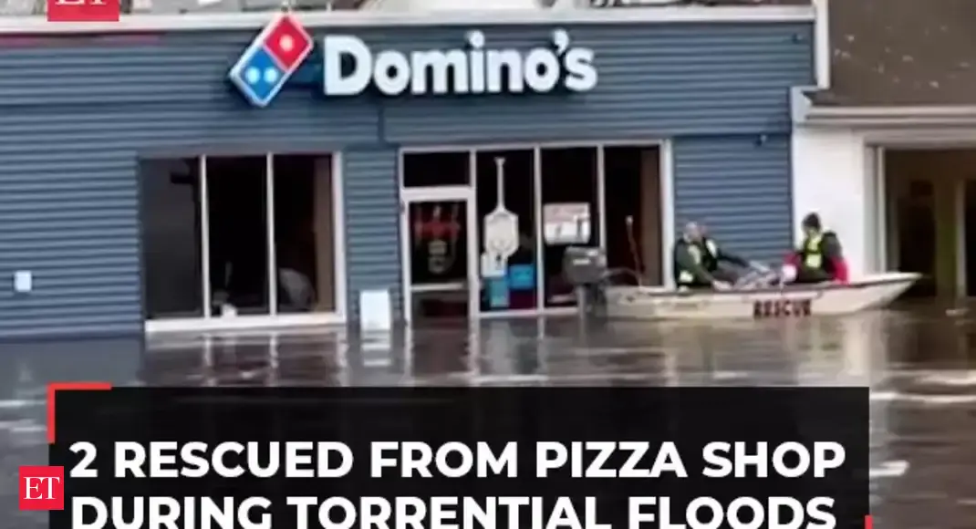 US: Two rescued from pizza shop during torrential floods - The Economic ...