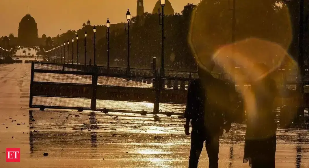 In pics: Sudden rain brings relief in Delhi amid scorching heat - Sudden change | The Economic Times