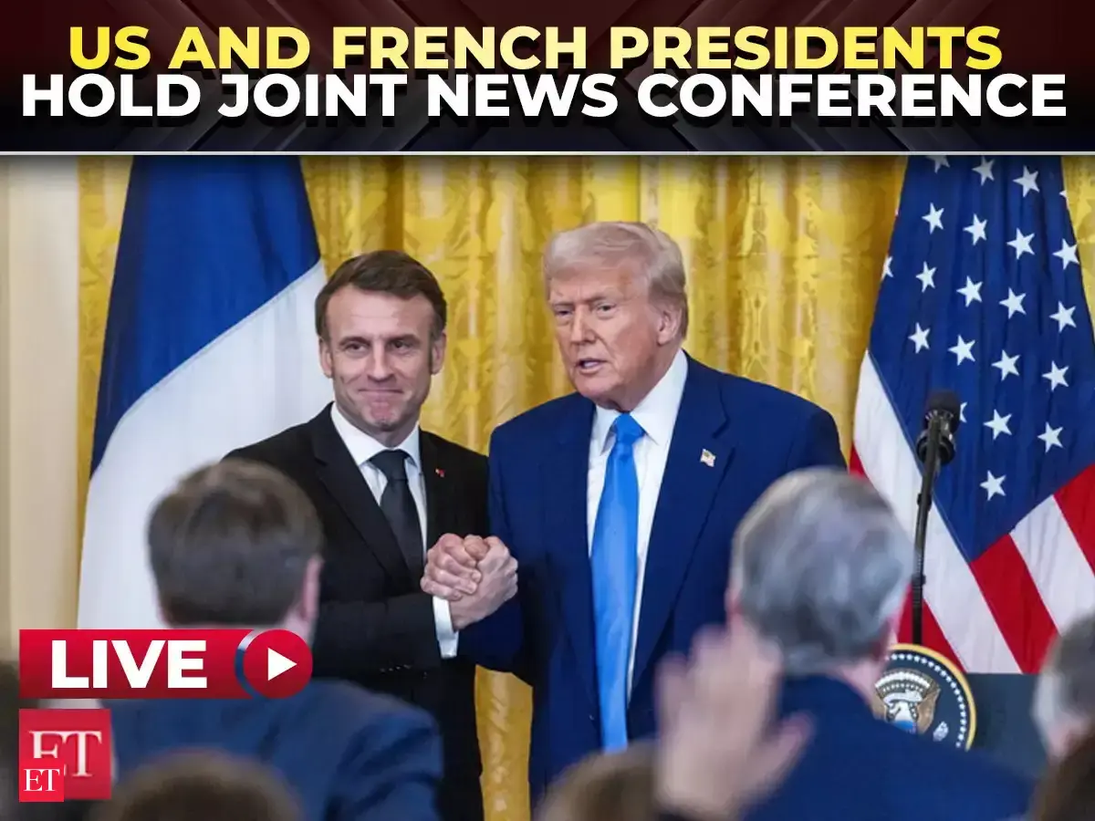 US President Donald Trump and French President Emmanuel Macron hold a ...