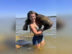 Catfish Girl noodling: Who is The Catfish Girl? Here’s all about Alabama influencer Hannah ...