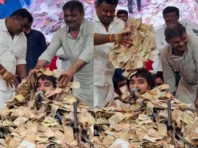 Viral Video: Devotees rain lakhs on Gujarati singer until he disappears ...