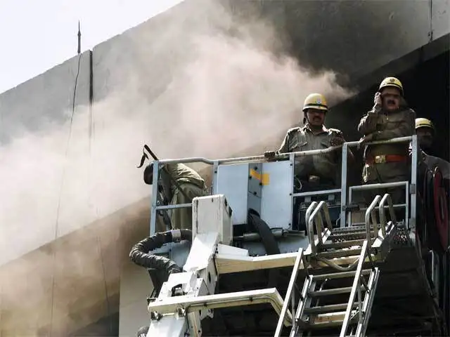 May 21, 2014 - Fire personnel at Shastri Bhavan | The Economic Times
