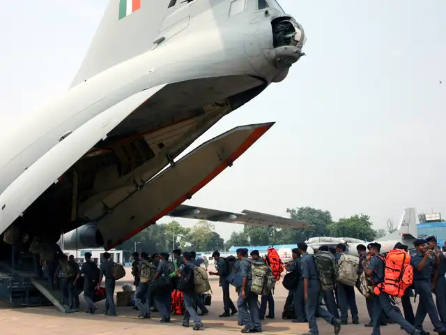 Rescue team boarding a Indian air force helicopter - J&K floods: Rescue ...