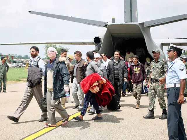Rescue team boarding a Indian air force helicopter - J&K floods: Rescue ...