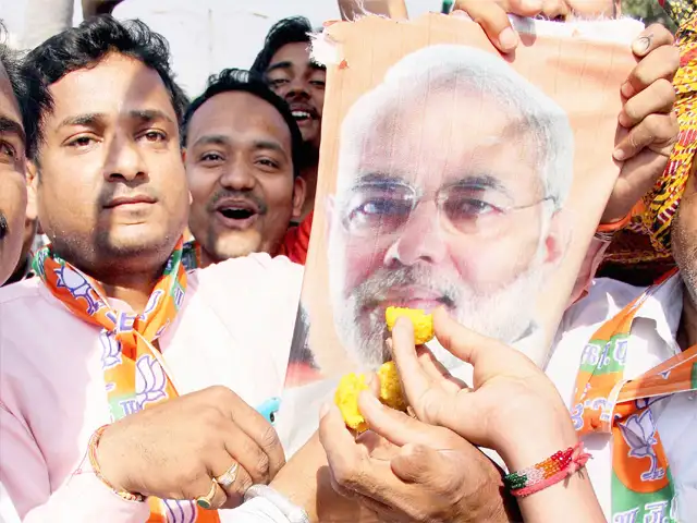 BJP supporters celebrating the party's victory - BJP celebrates the ...