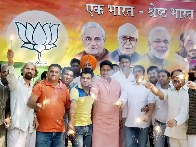 BJP supporters celebrating the party's victory - BJP celebrates the ...