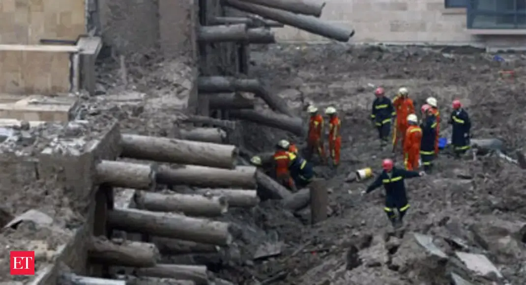 13-storey building toppled in Shanghai - | The Economic Times