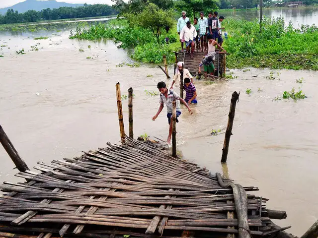 Monsoon woes: Assam hit by first wave of floods - Broken bamboo as ...