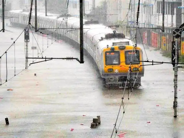 Waterlogged railway tracks - Heavy rainfall paralyses Mumbai, commuters ...