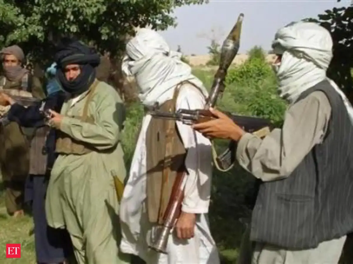 Taliban militants with their weapons - | The Economic Times