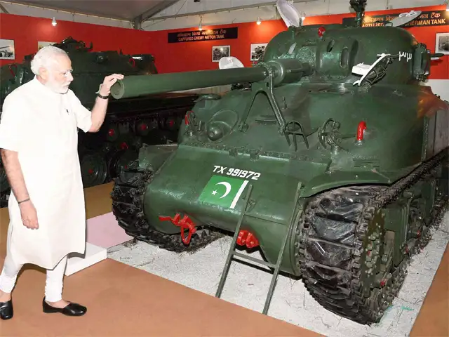 PM Modi with Rajnath Singh - PM Narendra Modi visits exhibition to mark ...