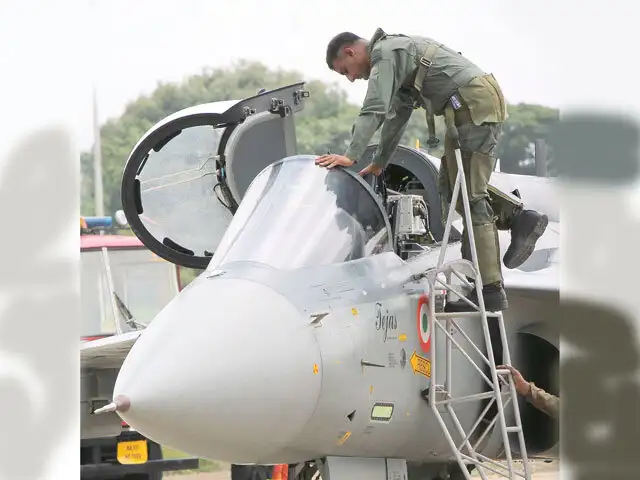 Tejas test pilot climbing into the cockpit - Tejas and the legacy of ...