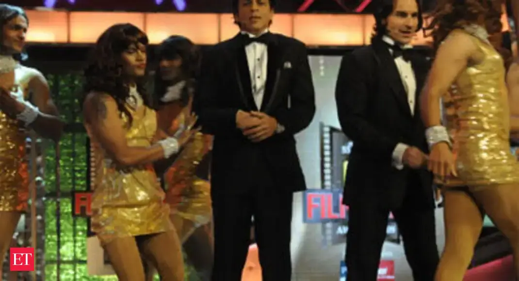 SRK greets Asha Tai - | The Economic Times