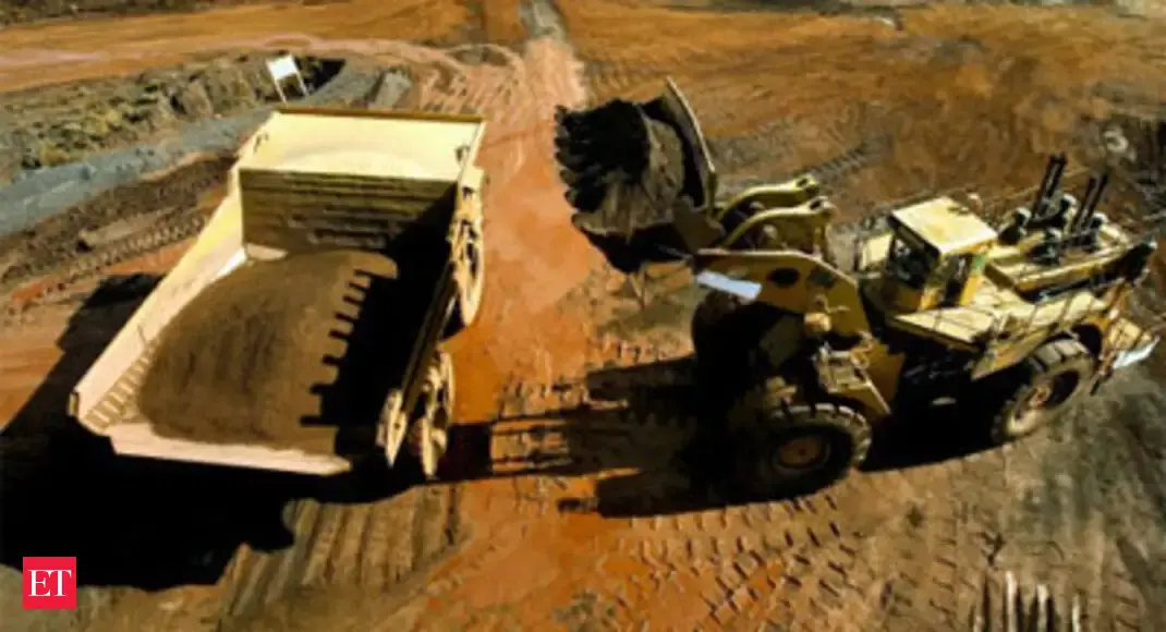 A haul truck is loaded with iron ore at a BHP Billiton mine in West ...