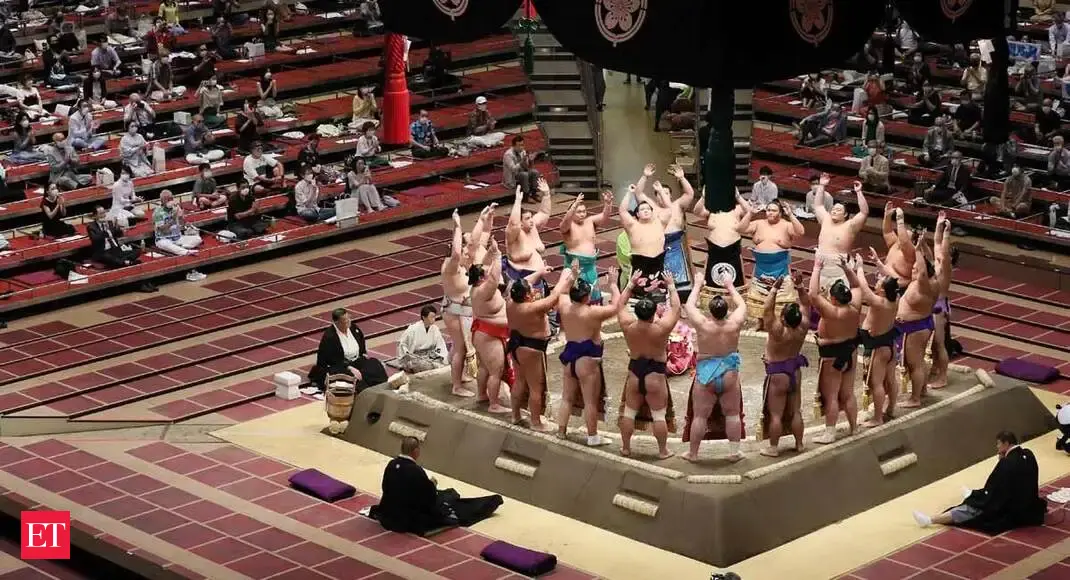 Sumo-Face-masked fans attend first day of sumo in five months ...