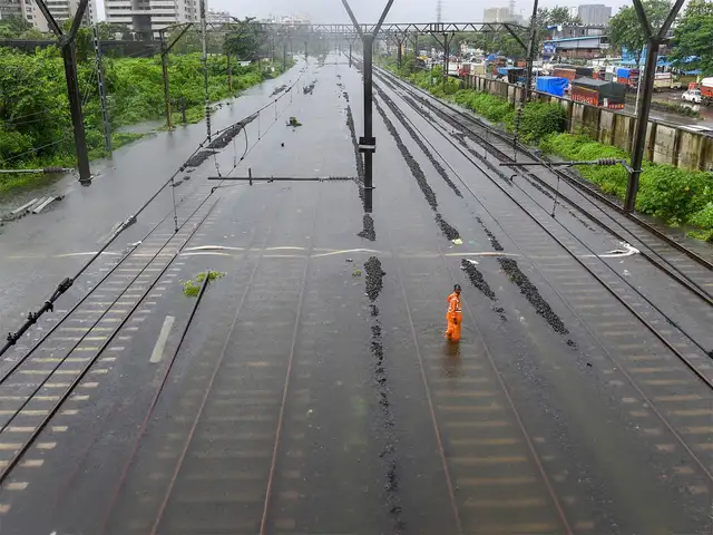 Train services hit - Mumbai rains cause mayhem, red alert on | The Economic Times