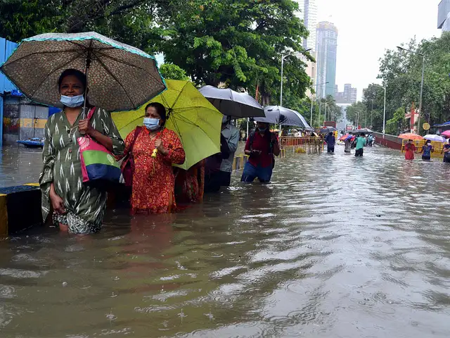 Train services hit - Mumbai rains cause mayhem, red alert on | The Economic Times