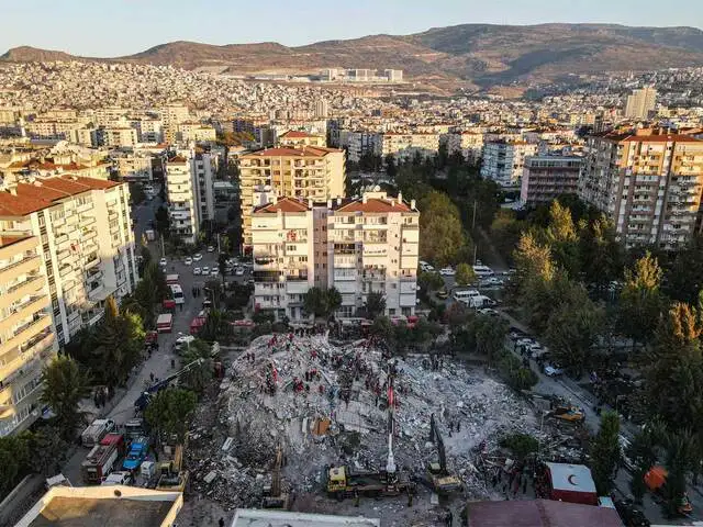 Destroyed car and collapsed buildings - Aftermath of deadly 6.7 ...