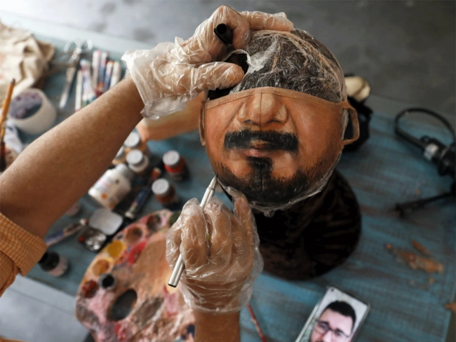 This artist will paint your face on a mask so you don't hide behind one ...