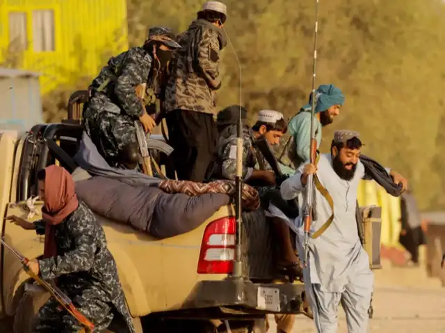 amusement park: Battle-hardened Taliban fighters enjoy a day off at ...