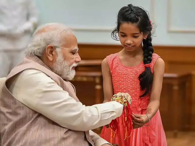 Videos of Modi with girls - Modi celebrates Rakhi with PMO staff ...