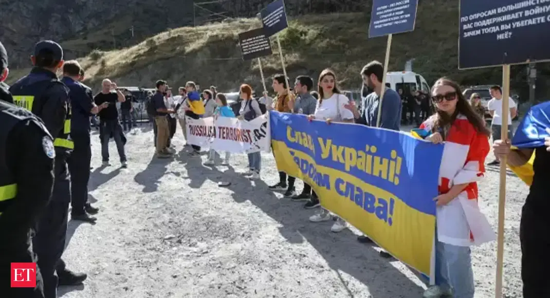 Protest at Georgian border as Russian citizens continue to arrive - The ...