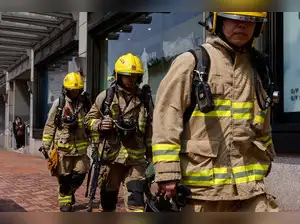 empire group: Firefighters battle blaze in Hong Kong shopping district ...