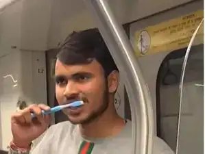 delhi metro: Video of a man brushing his teeth inside a Delhi Metro ...