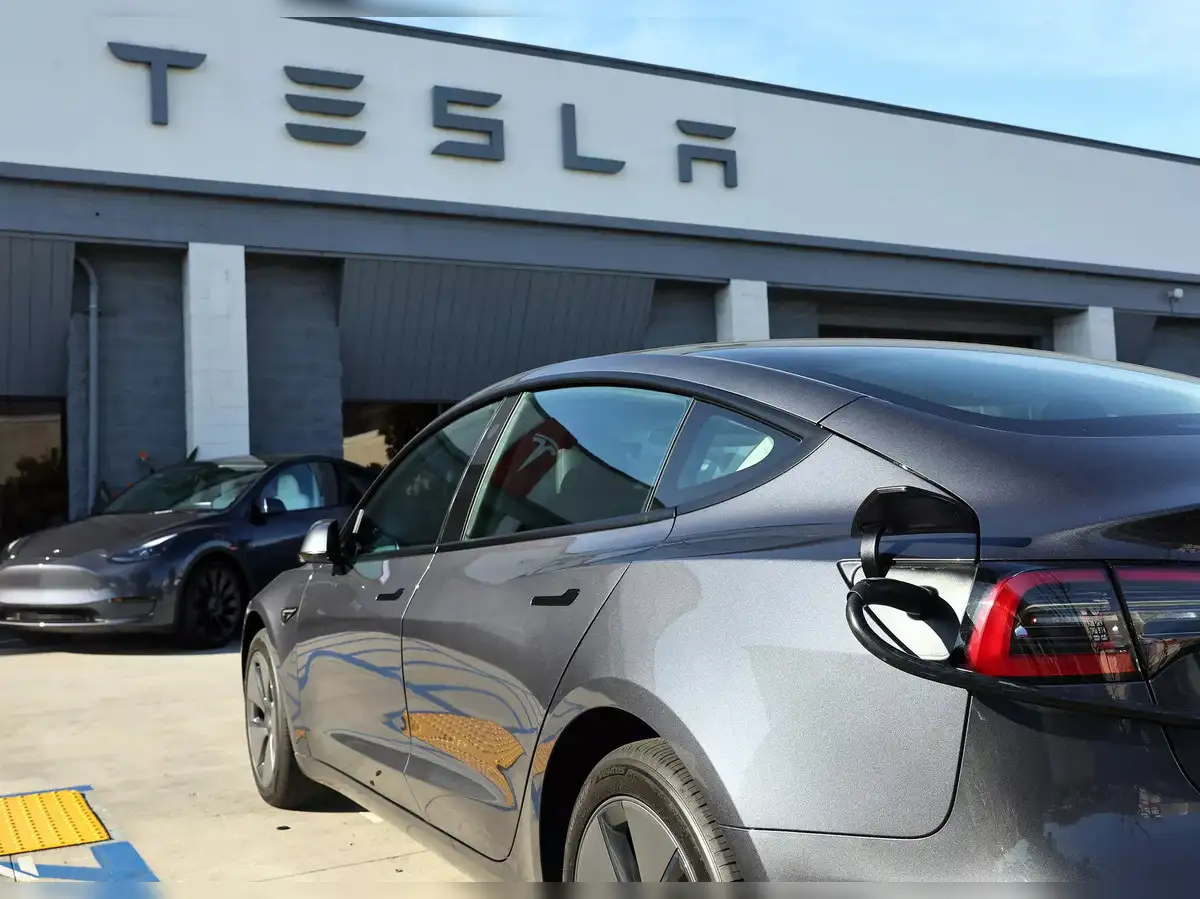 uber tesla: Uber says it's working with Tesla to boost EV adoption ...