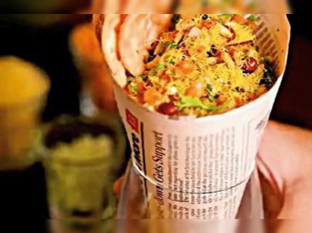 Eating hot, chilli snacks - The Economic Times