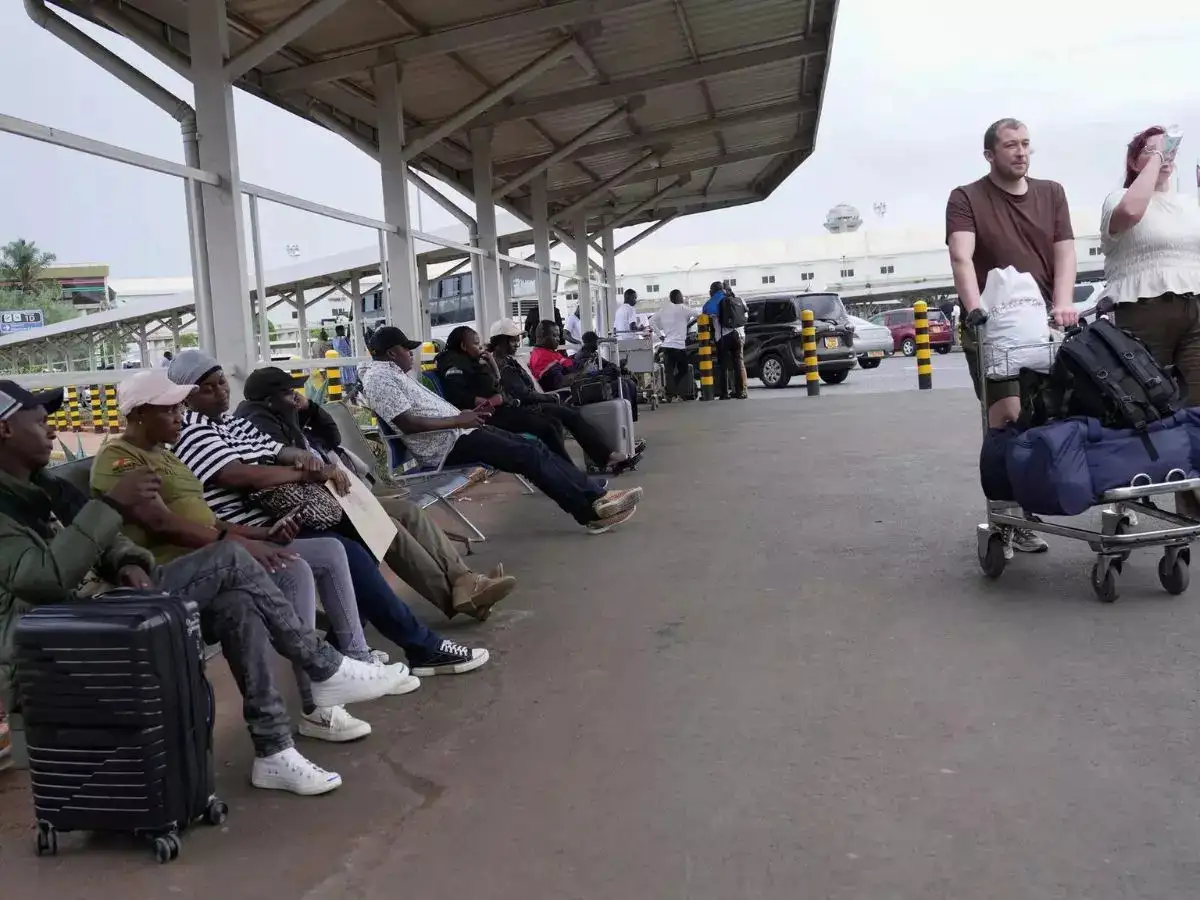 A strike by workers at Kenya's main airport delays flights and strands ...