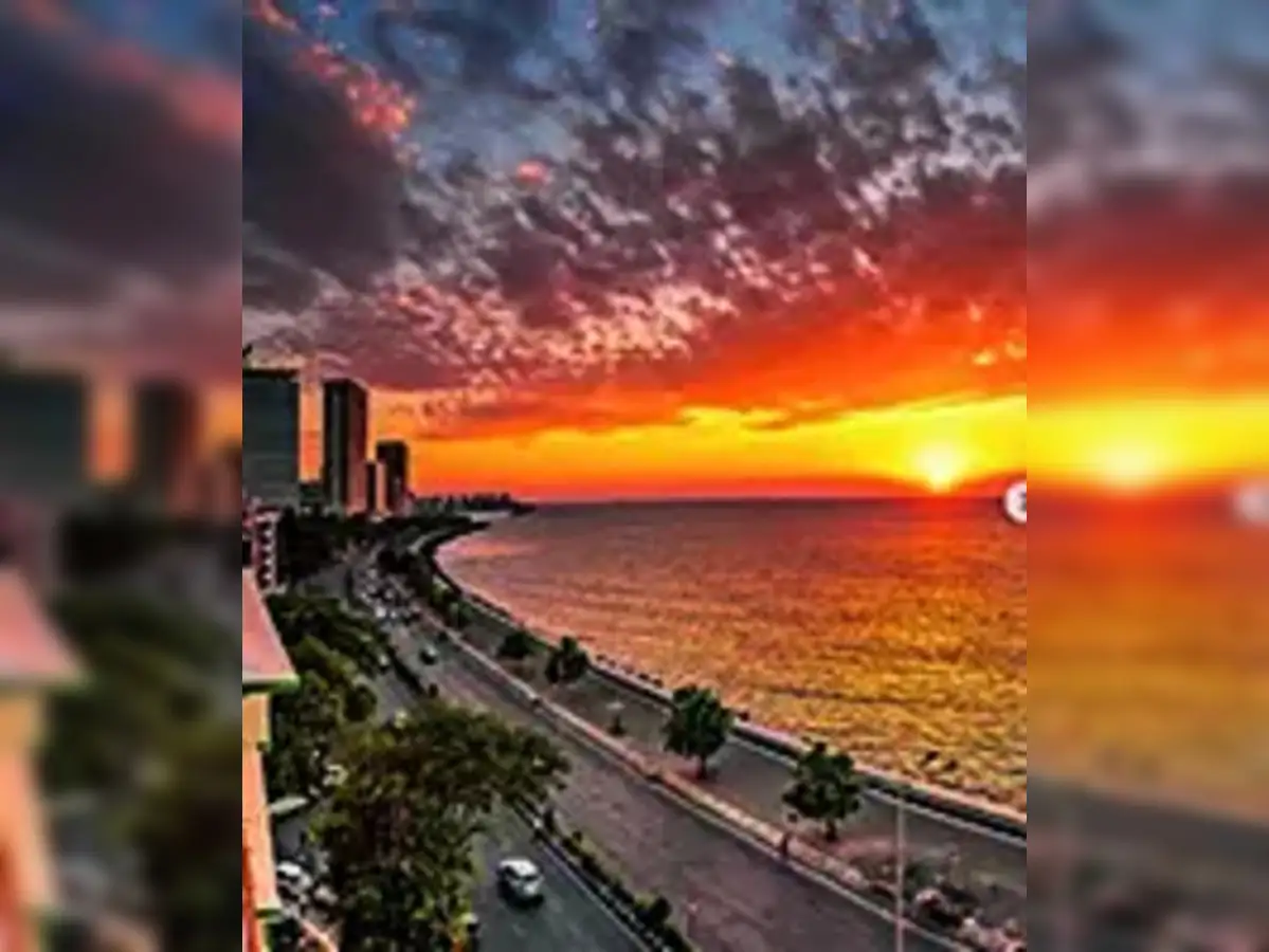Watching sunset along a coastline - The Economic Times