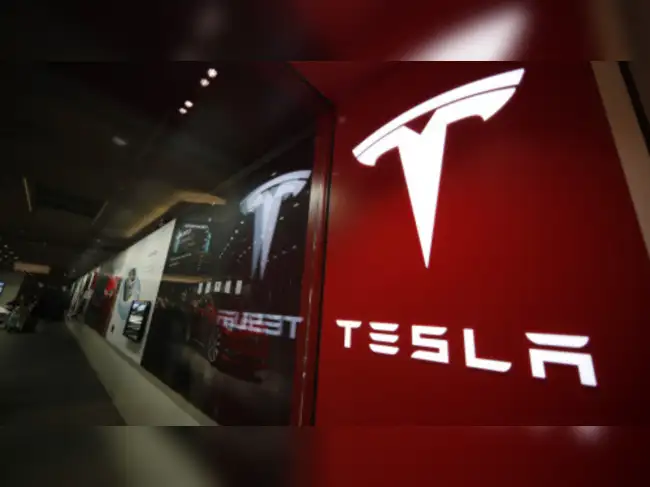 Tesla: Tesla reports profit drop on price cuts, lower vehicle sales ...
